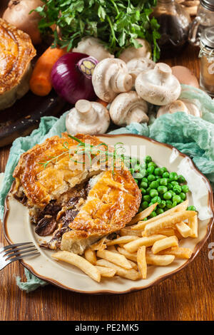 Homemade beef stew pie with french fries. Meat in puff pastry Stock ...