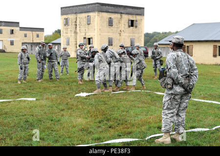U.S. Soldiers assigned to 102nd Signal Battalion conduct a litter ...