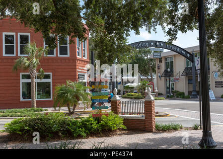 Dunedin town centre, Florida, USA with an overhead sign. Defending ...