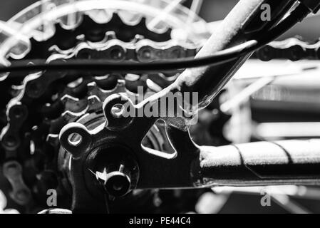 Closeup image of the mechanical parts of a bikes rear gear cog system ...