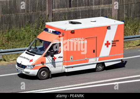 German Red Cross Mercedes-Benz Sprinter van on motorway. The German Red ...