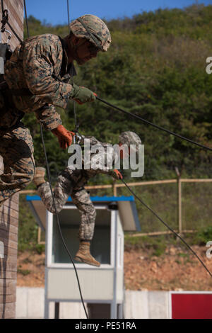 A mortarman with Echo Company, 2nd Battalion, 3rd Marine Regiment ...