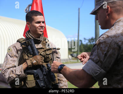 U.S. Marine Sgt. Maj. Roger Griffith (left) regmimental sergeant major ...
