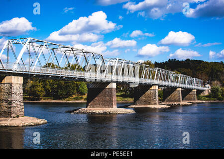 View of country, pillar and span of a bridge over the Kali Brantas ...