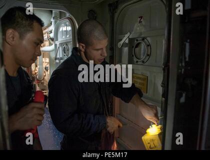 ARABIAN GULF (Sept. 25, 2015) Command Master Chief Pete Santos conducts ...