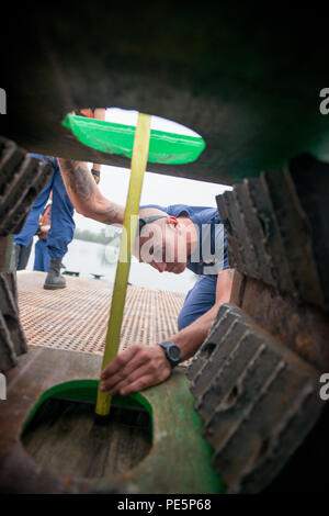 The crew of the Coast Guard Cutter Sledge, a 75-foot River Buoy Tender ...