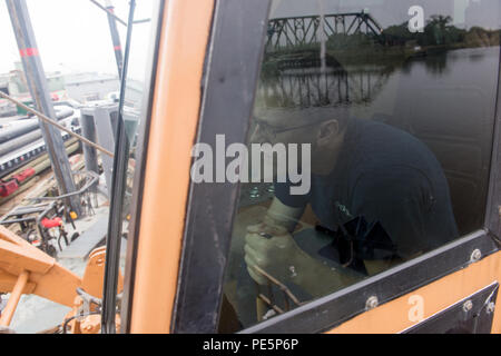 The crew of the Coast Guard Cutter Sledge, a 75-foot River Buoy Tender ...