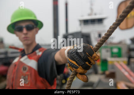 The crew of the Coast Guard Cutter Sledge, a 75-foot River Buoy Tender ...
