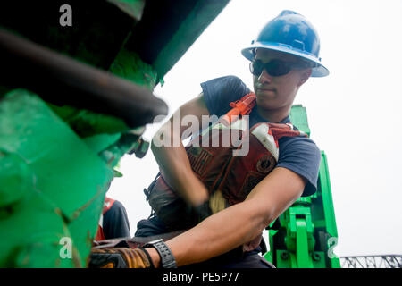 The crew of the Coast Guard Cutter Sledge, a 75-foot River Buoy Tender ...