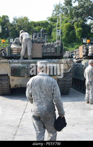 An M1 Abrams tank maintainer from Charlie Company, 1st Battalion, 8th ...