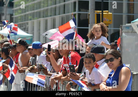 Spectators attend the Dominican Day Parade on August 8, 2021 on the ...