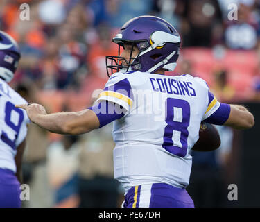 Minnesota Vikings quarterback Kirk Cousins, right, chats while arming ...