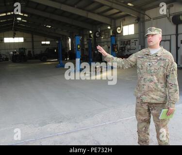 U.S. Army Lt. Col. Edgar and Maj. Arntson salute during the playing of ...