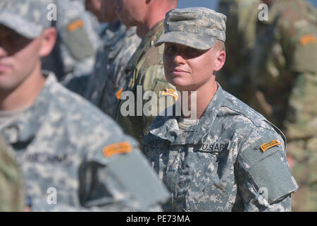 U.S. Army Maj. Lisa Jaster is congratulated by Capt. Kristen Griest ...
