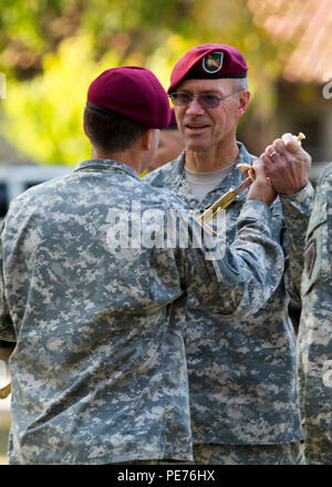 Command Sgt. Maj. Harry Bennett (right) passes the sword to Maj. Gen ...