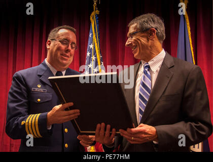 The crew of the Coast Guard Cutter Boutwell (WHEC 719) line the deck as ...