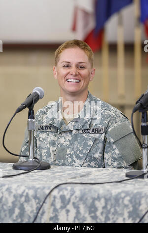 U.S. Army Reserve Maj. Lisa Jaster, right, becomes the third woman to ...