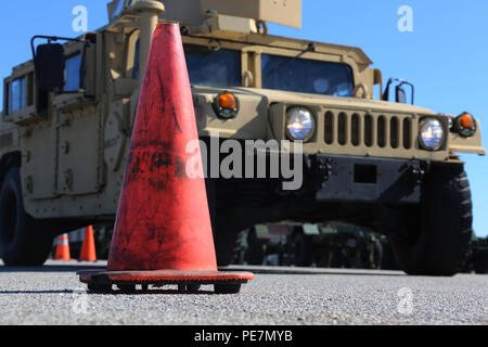 Marines maneuver a Humvee through a modified barrier during an ...
