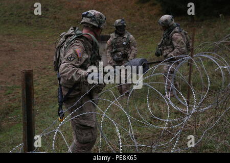 Soldiers set up concertina wire obstacles during the October Sapper ...