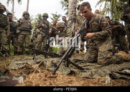 TANDUO BEACH, Malaysia (Nov. 10, 2015) A Malaysian soldier looks ...