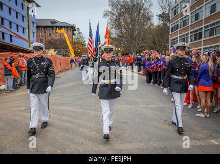 The Clemson University Pershing Rifles honor guard lead the parade into ...