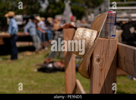 Cowboy hats and gloves rest ontop of fence posts at the 2018 Ram Rodeo ...