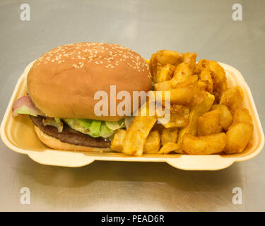 British "chip shop" style fried cod in batter with chips (french fries ...