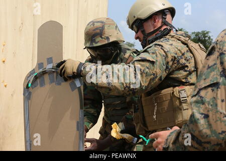 Marines prepare an oval charge for use during urban breaching Stock ...