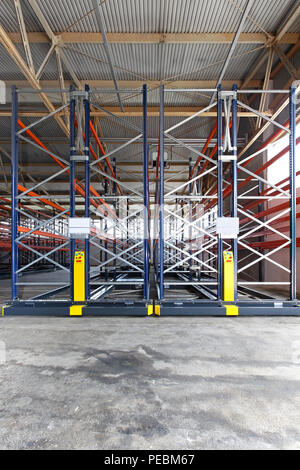 Mobile roller racking system in distribution warehouse Stock Photo - Alamy