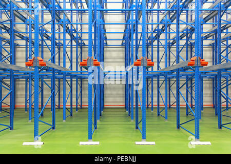 Blue shelving system in distribution warehouse Stock Photo - Alamy