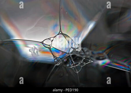Soap bubbles show the interference of light reflecting off the surfaces ...