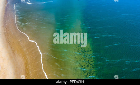 Photo from a flying drone, sandy beach by the sea on a sunny day in ...