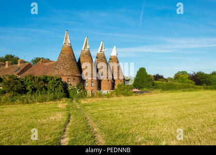Ickham village, Kent in England. View along a large brick farmhouse ...
