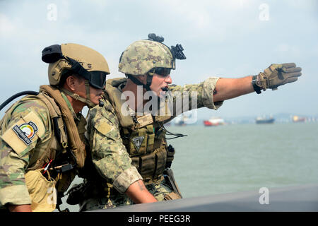 Boatswain's Mate communicates with a Kopaska of the Indonesian Navy ...