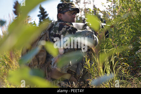 A Nepalese Army Ranger pulls security for U.S. Army Soldiers during the ...