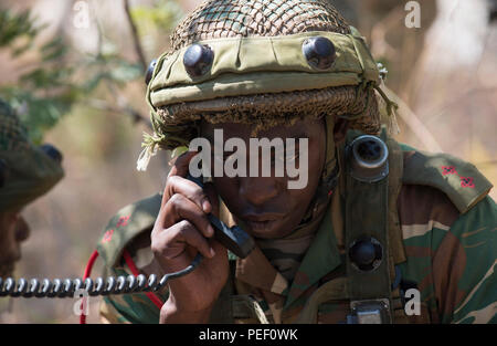 A soldier with the Zambian Defense Force radios in to command post ...