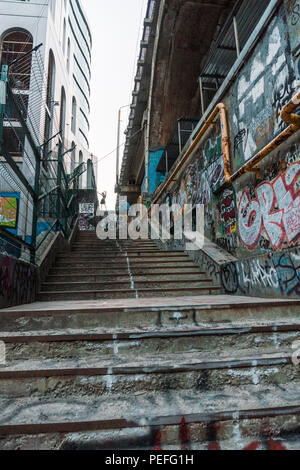 Wide shot of Street punk girl in Urban. Girl Sitting on the Stairs ...
