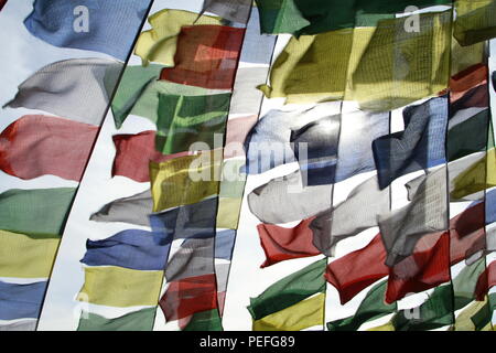 Buddhist Prayer flags backlit by the sun and flapping in the wind Stock ...