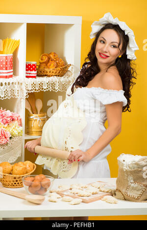 Portrait of happy caucasian mother prepares her little cute child for a ...