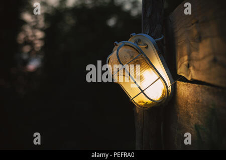 Broken street lamp in a wooden pole Stock Photo - Alamy