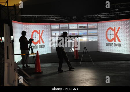 An employee of Conflict Kinetics demonstrate techniques to the invited ...