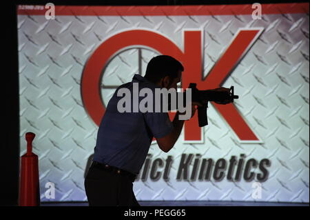 An employee of Conflict Kinetics demonstrate techniques to the invited ...