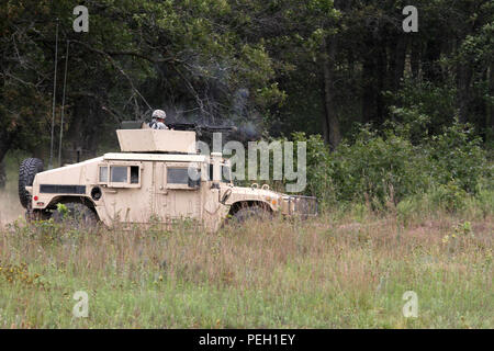 A Humvee gunner from the 32nd Military Police Company, 157th Maneuver ...