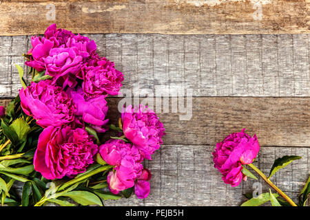Fuchsia flowers on an old wooden background, close-up. copy space Stock ...