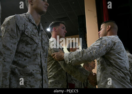 Marine 1st Lt. David Mitchell, platoon commander, discusses his avenue ...