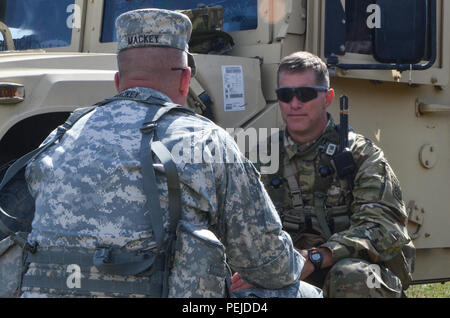 U.S Army Col. Colin Tuley, center, Brigade Commander of 1st Brigade ...