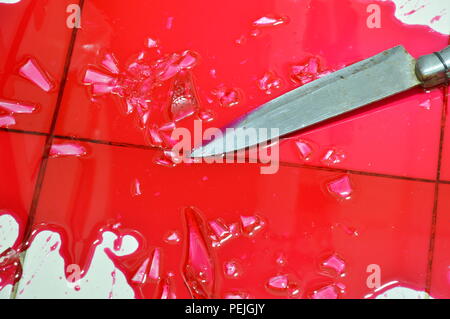 knife and lot of blood splash on tile floor Stock Photo - Alamy