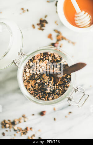 Buckwheat and chocolate granola with hazelnuts in glass jar Stock Photo ...