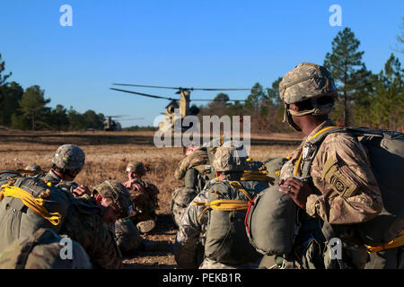 Troops from the 82nd Airborne Division wait at the Port-au-Prince Stock ...