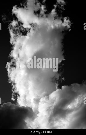 Cumulus clouds with vertical growth creating dramatic cloud shapes ...
